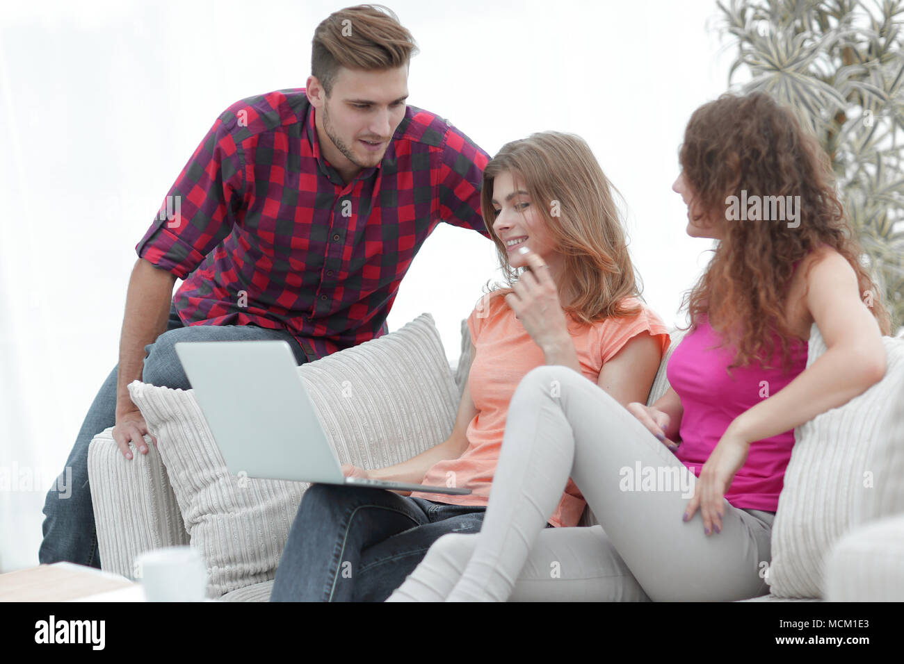young people talking in the living room Stock Photo - Alamy