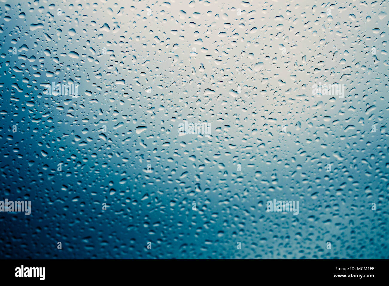 Water drops on car glass while it rains Stock Photo - Alamy