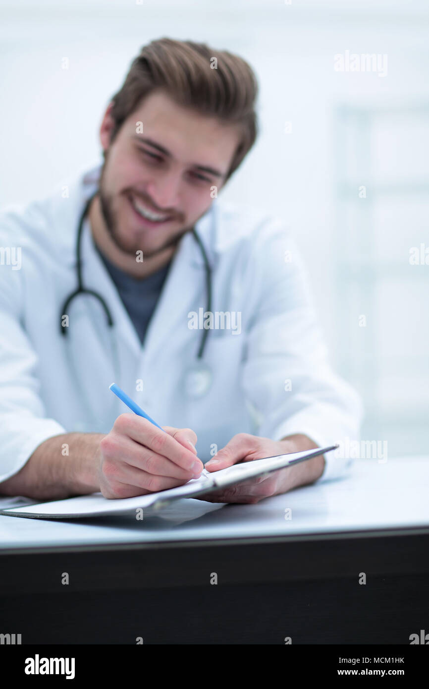 background image of a doctor writing out a prescription Stock Photo - Alamy