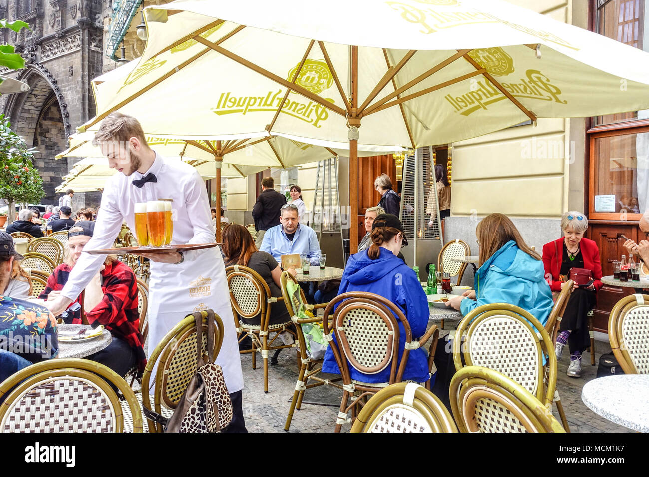 Prague restaurant people Waiter serving beer outside Prague Cafe ...