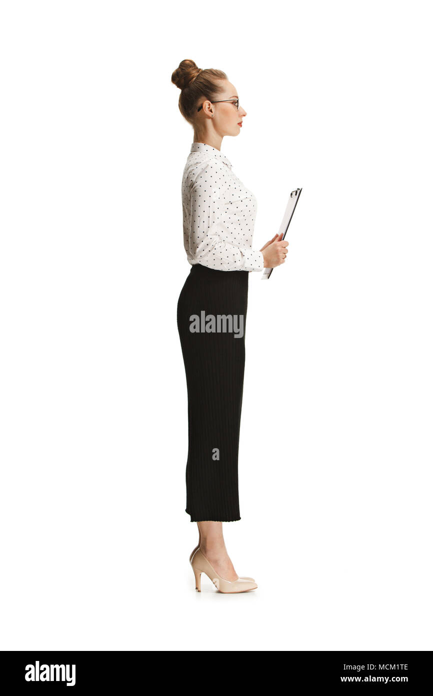 Full length portrait of a female teacher holding a folder isolated ...