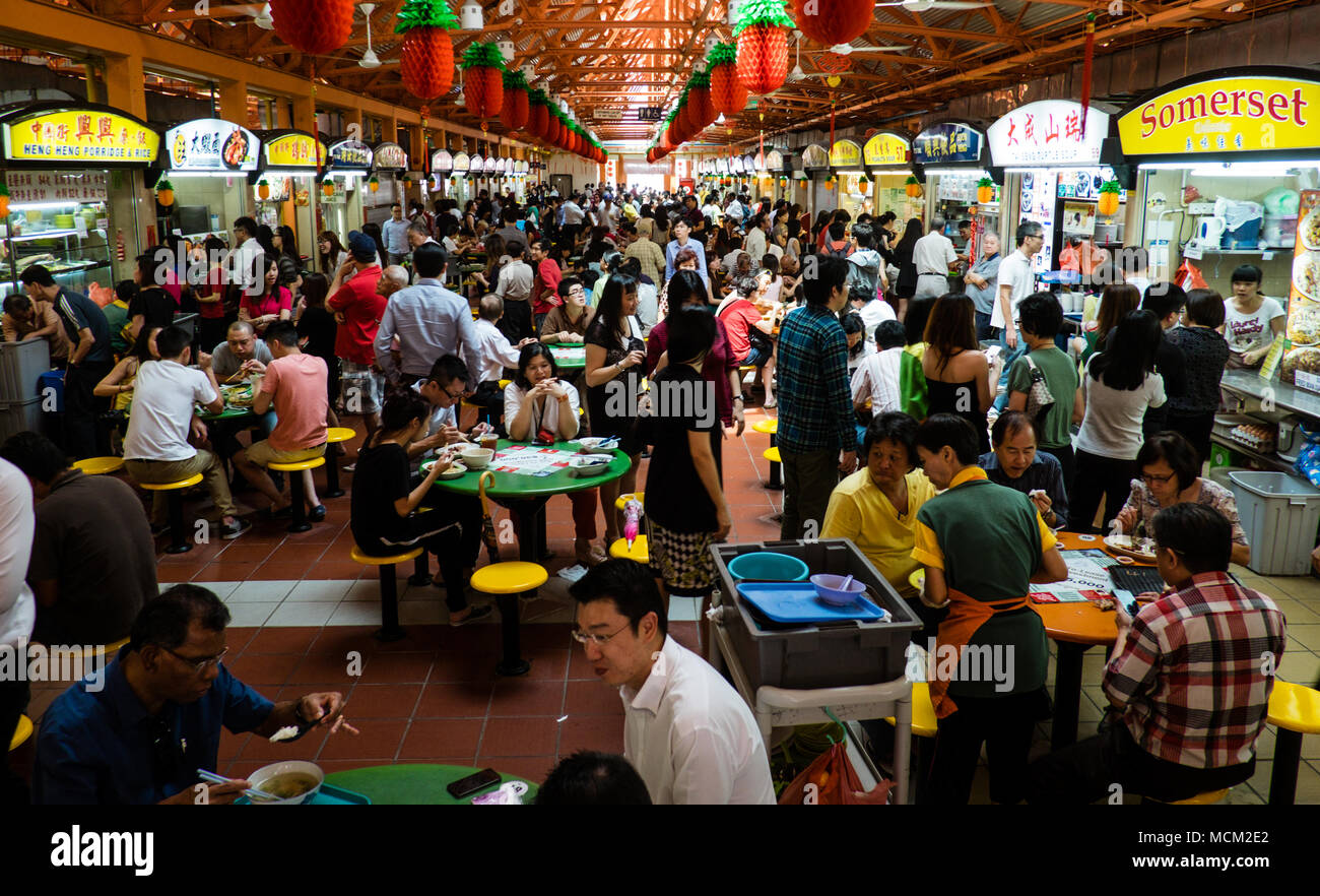 Singapore - January 21, 2014: A very busy hawker centre, where ...