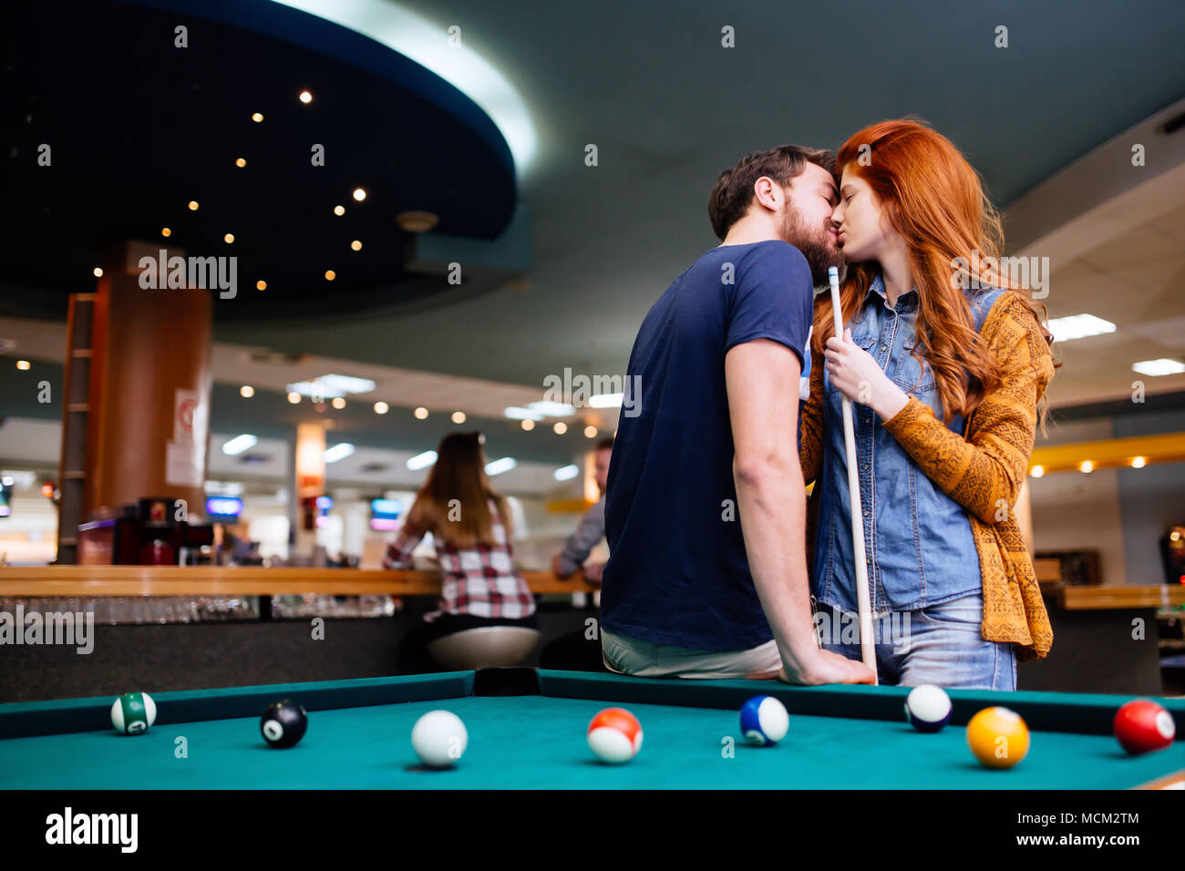 Couple kissing in bar hi-res stock photography and images - Alamy