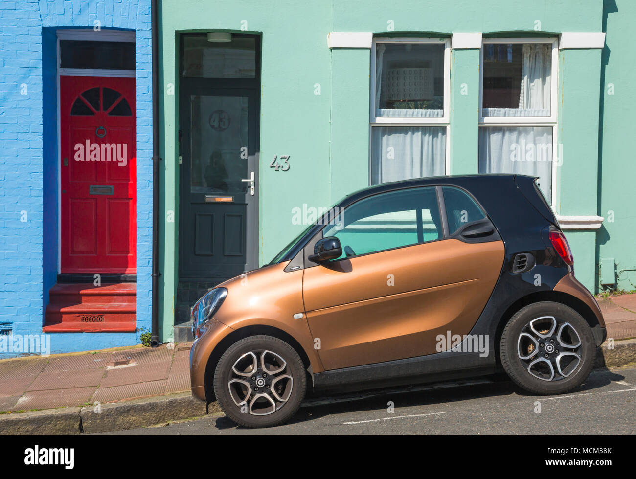 Smart car parked outside colourful terraced houses in Blaker Street ...