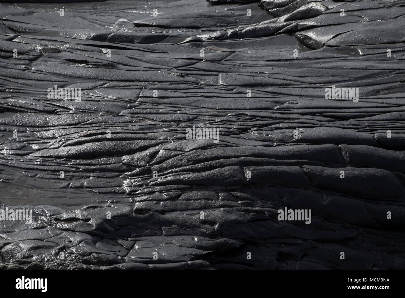 black wet volcanic rock background, coast close to Banaderos, Gran ...