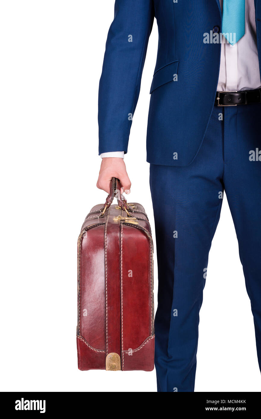 Businessman holding suitcase in hand, isolated over white background ...