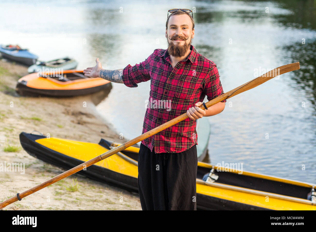 Man holding paddle hi-res stock photography and images - Alamy