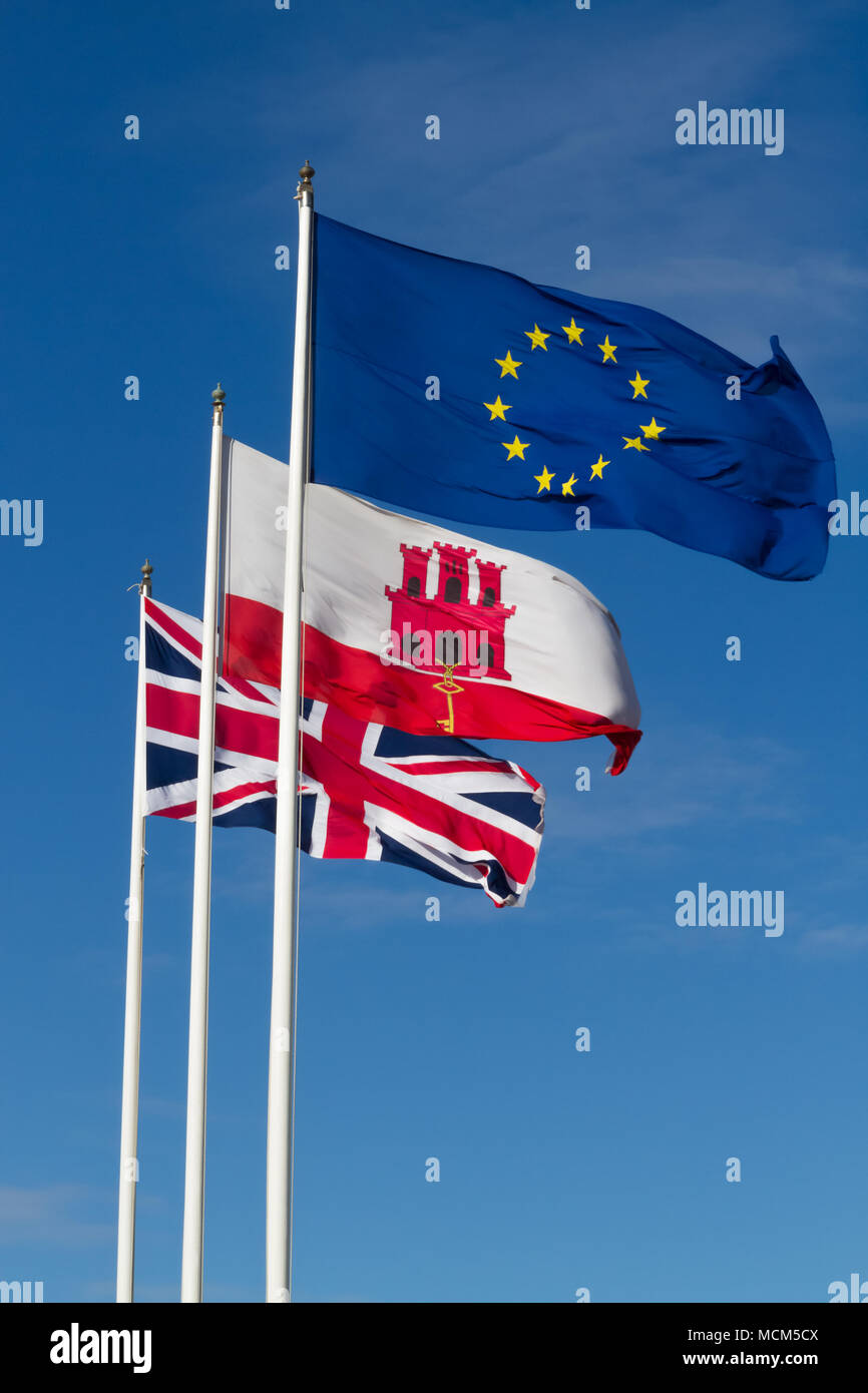 Three flags at the Spanish - Gibraltar frontier: Europe, Gibraltar and ...
