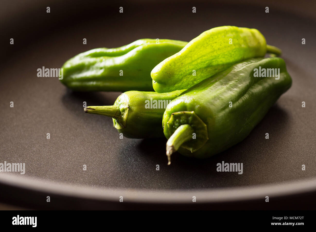 Green Padron Peppers in the Frying Pan. Pimientos de Padron Stock Photo ...