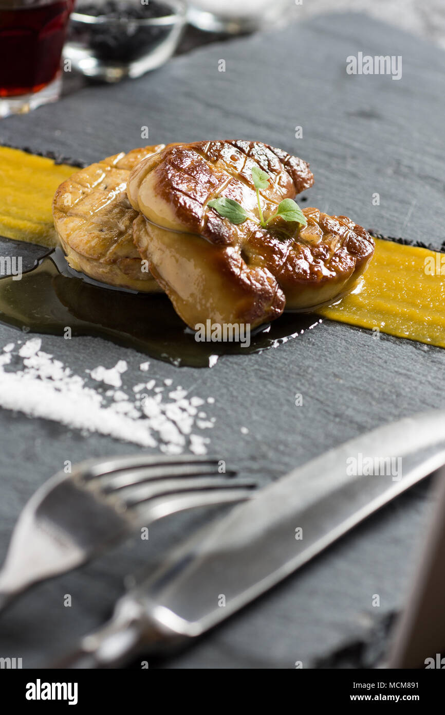 Fried Goose Liver. Foie Gras with Mango Puree Stock Photo - Alamy