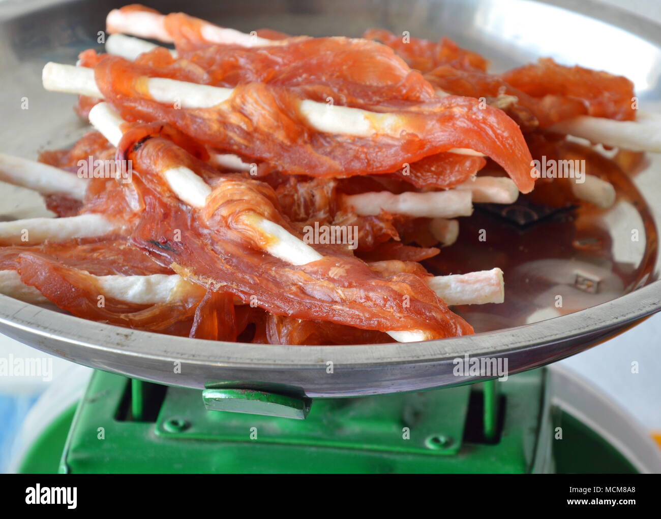 dog bone on weighing scale for sale Stock Photo - Alamy