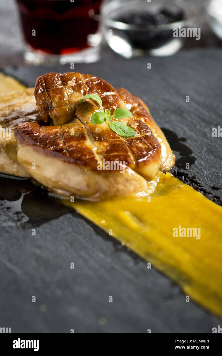 Fried Goose Liver. Foie Gras with Mango Puree Stock Photo - Alamy