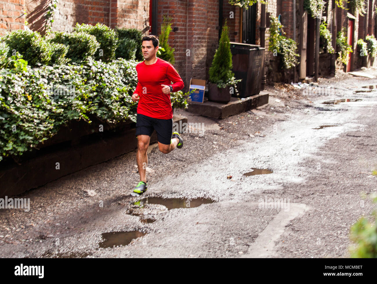 Runner jogging in street hi-res stock photography and images - Alamy