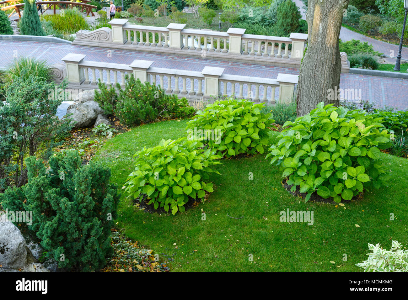 stone bridge with balusters on a slope in landscape design Stock Photo ...