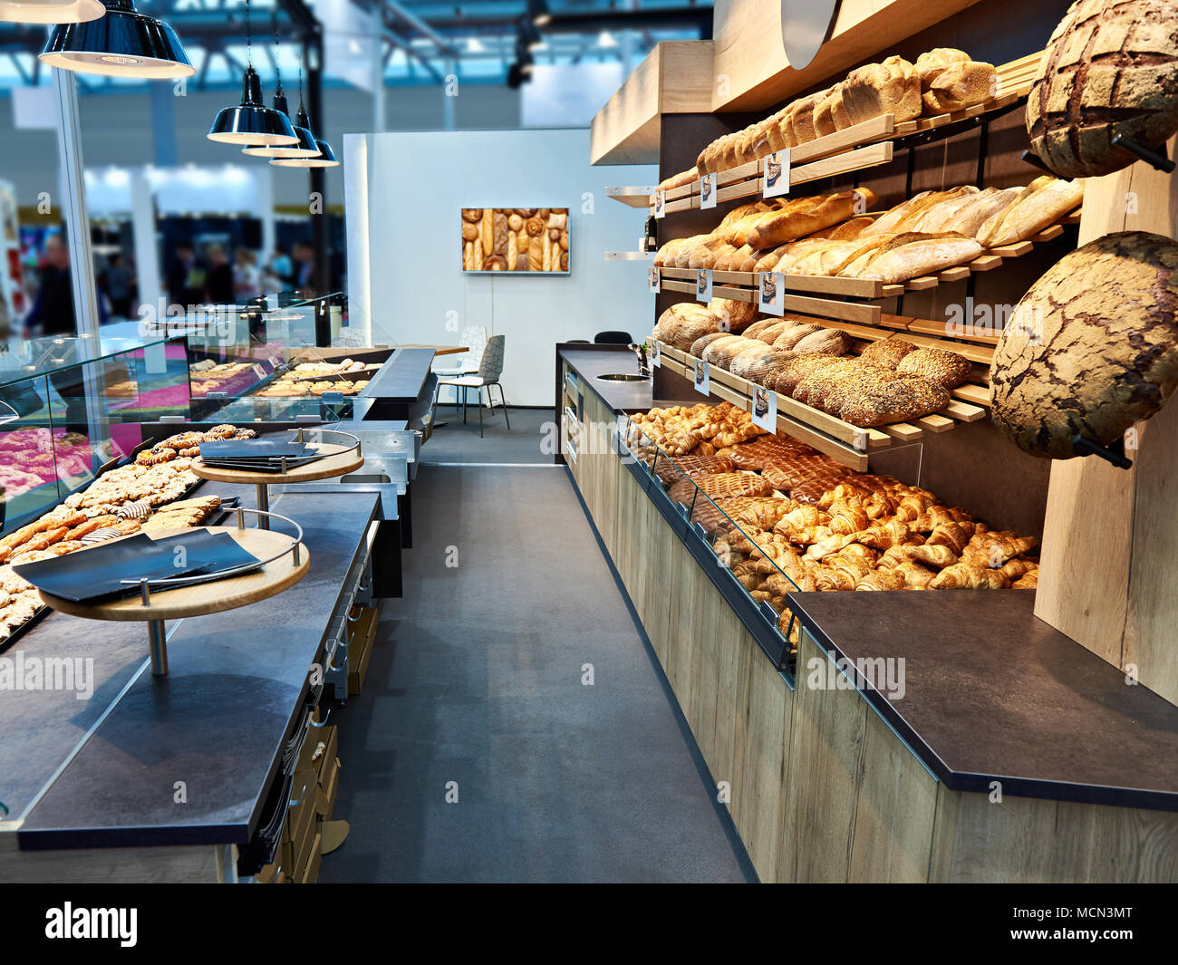 Fresh bread and pastries on shelves in a bakery Stock Photo - Alamy