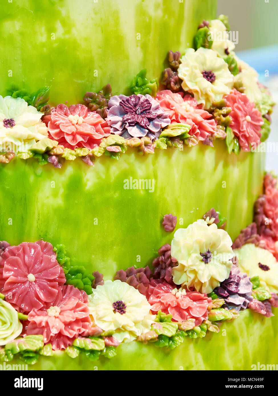 Cream color flowers on the cake Stock Photo - Alamy