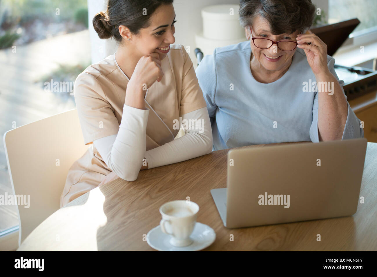 Old woman reading glasses computer hi-res stock photography and images ...