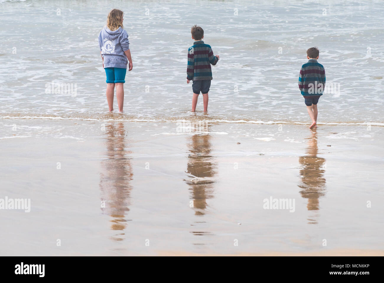 Children paddling in the sea on Fistral Beach in Newquay Cornwall Stock ...