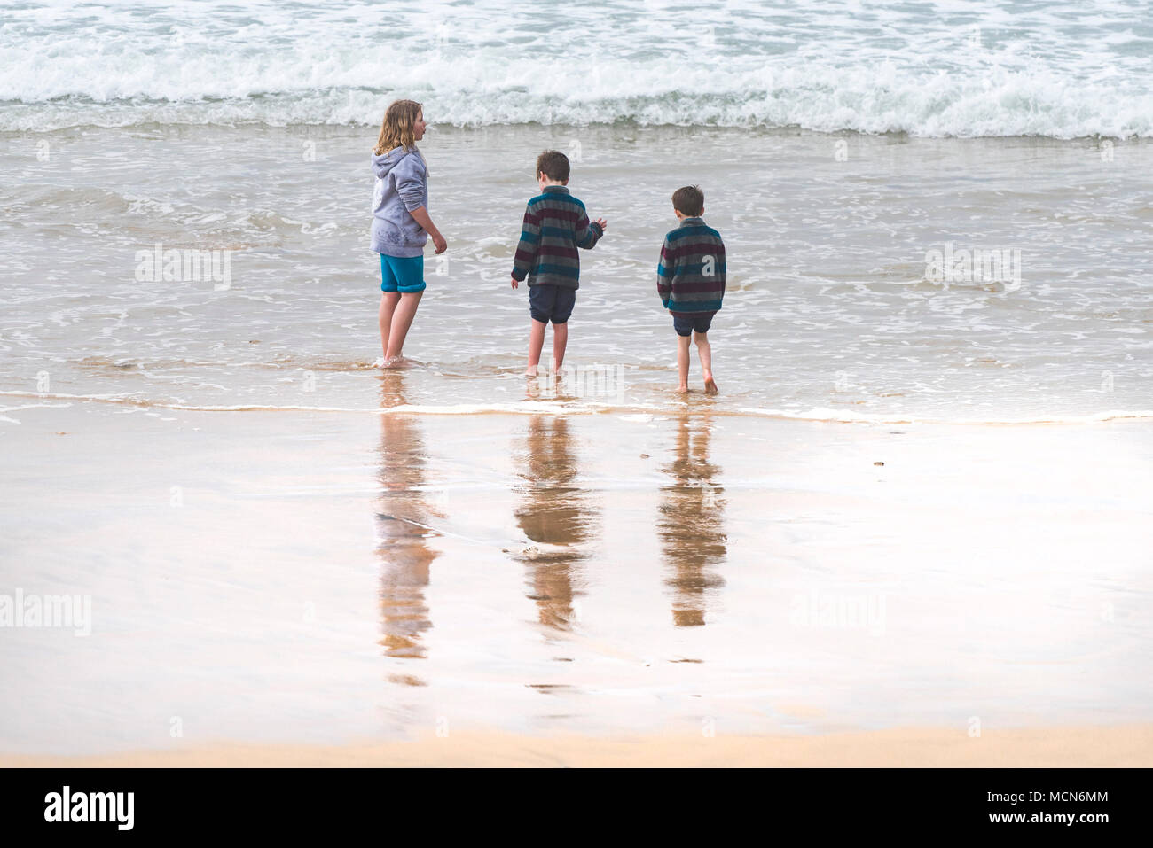 Children paddling in the sea on Fistral Beach in Newquay Cornwall Stock ...