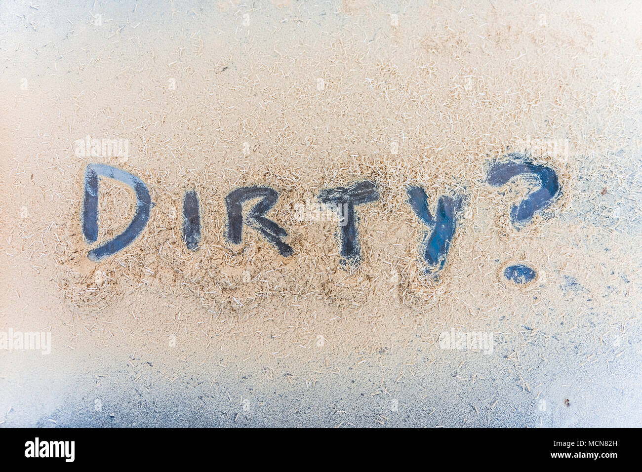 Overhead of dirty question written in sawdust Stock Photo - Alamy