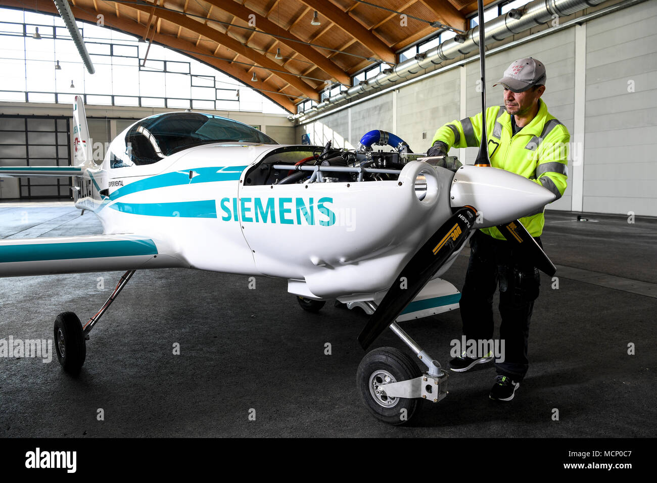 17 April 2018, Germany, Friedrichshafen: A technician checks the ...
