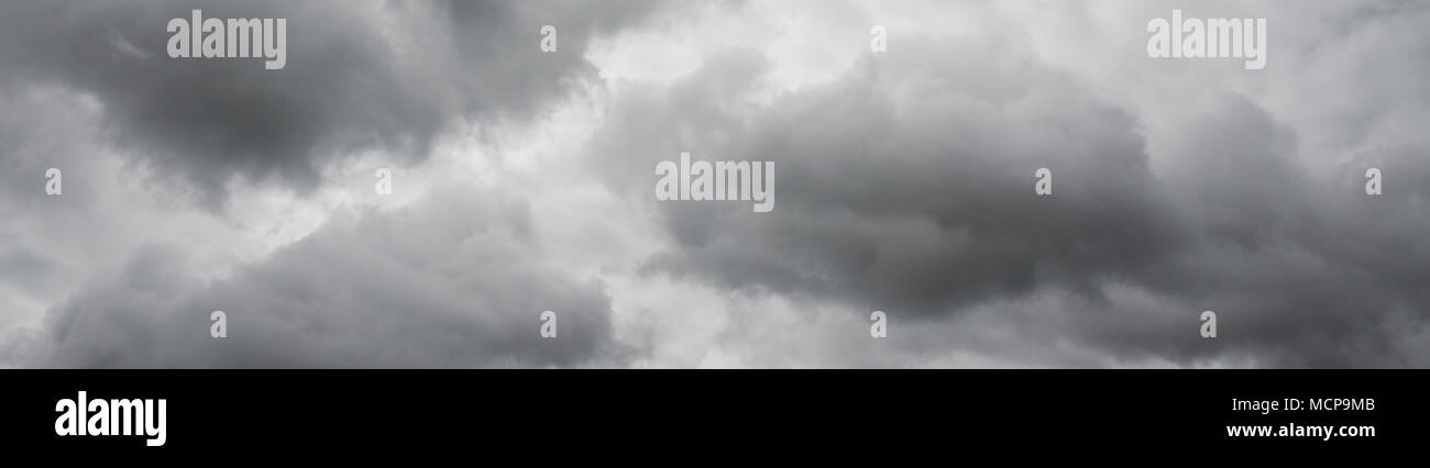 Rainy clouds flying over horizon. Dramatic cloudy sky Stock Photo - Alamy