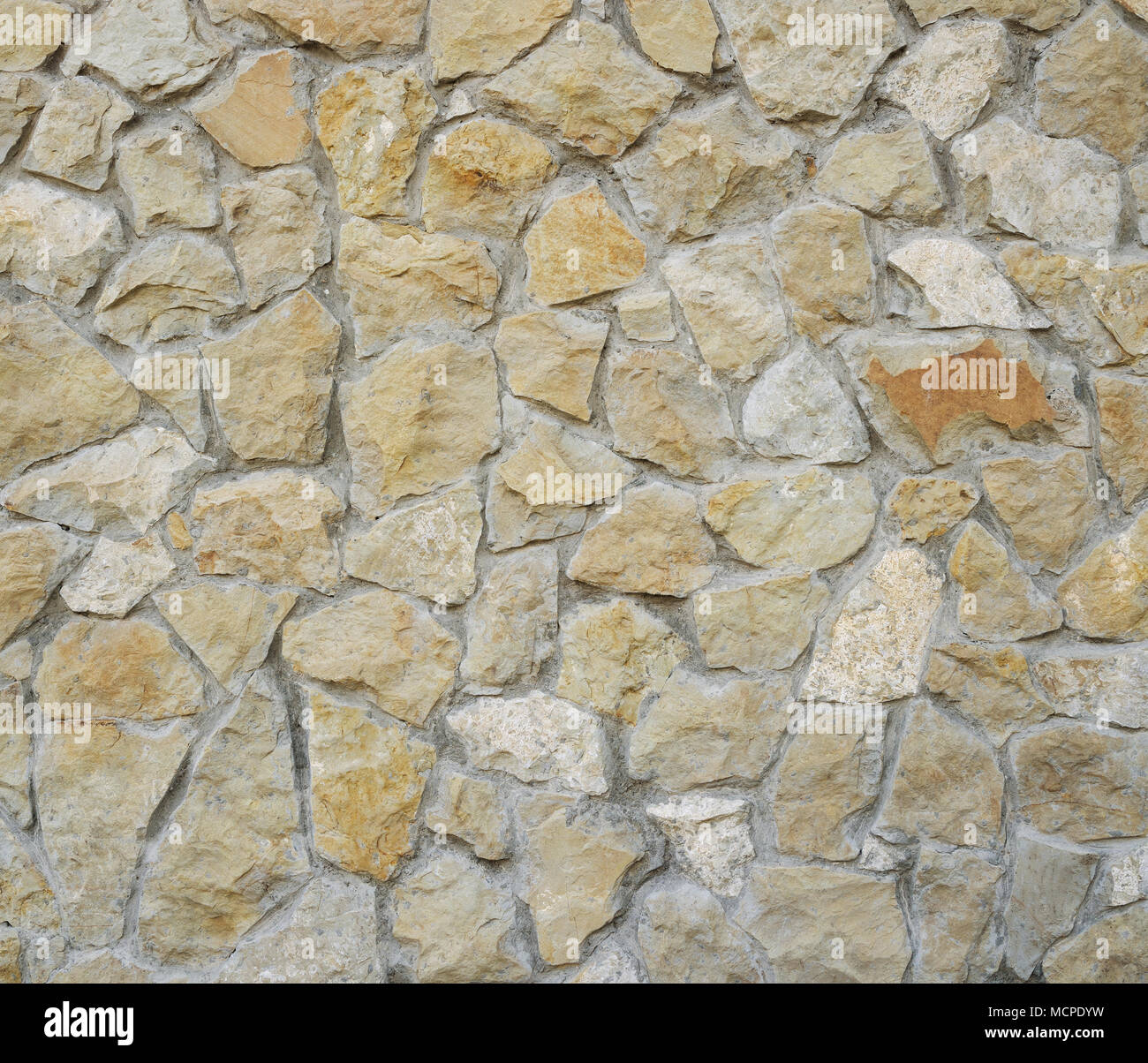 Old yellow stone pavement texture. Ancient natural cobblestone road as ...