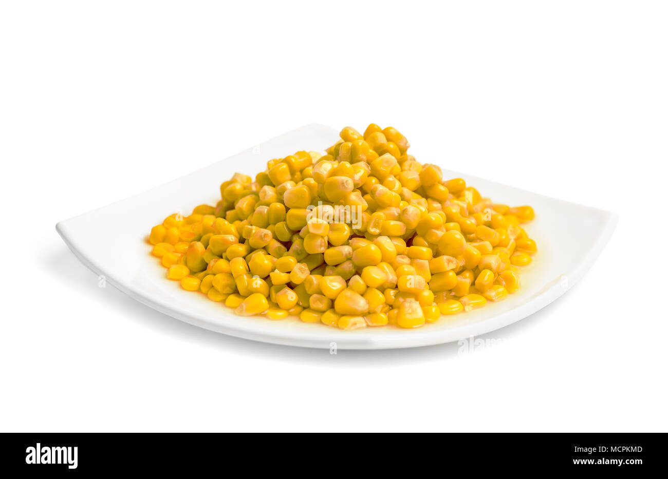 Portion of cooked corn on plate side view. Isolated on white Stock ...