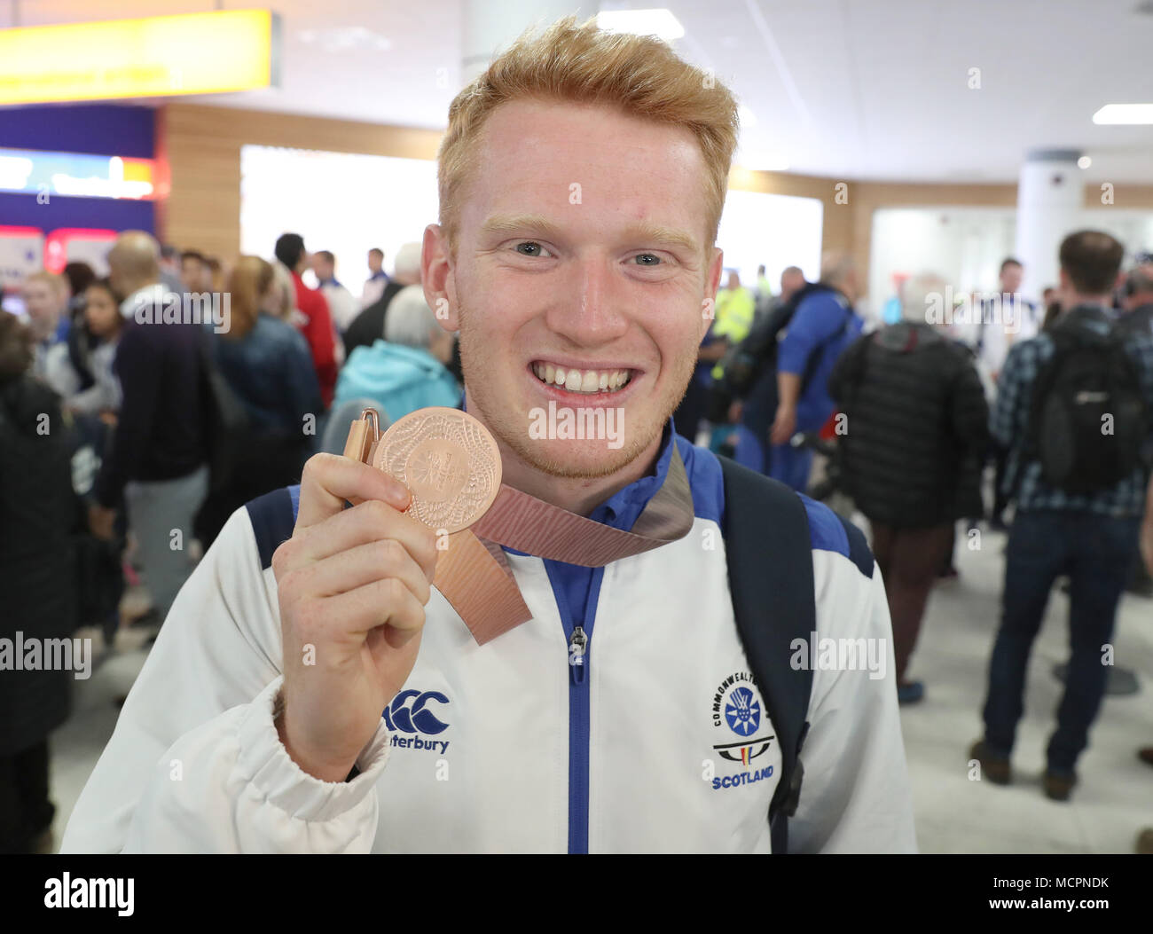 Team Scotland's James Heatly with his bronze medal as he arrives at ...