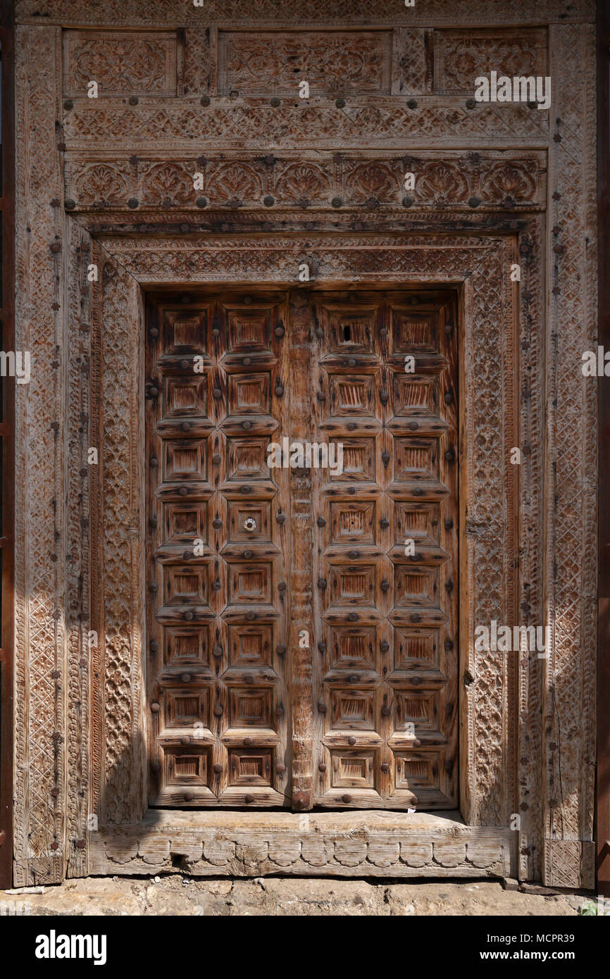 Antique wodden door covered with fantastic carvings Stock Photo - Alamy