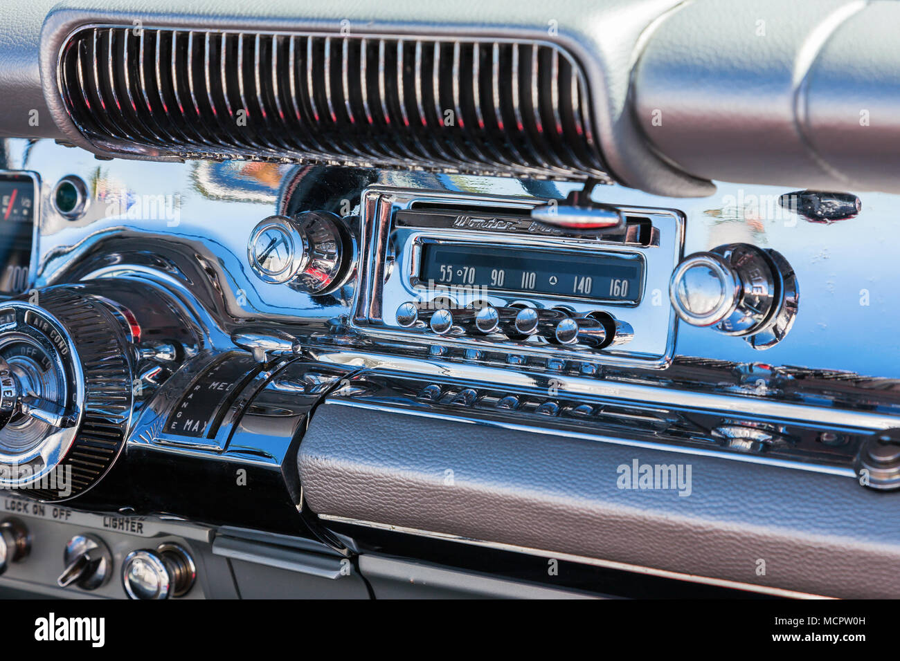 Car radio into the dashboard which is chromed Stock Photo - Alamy