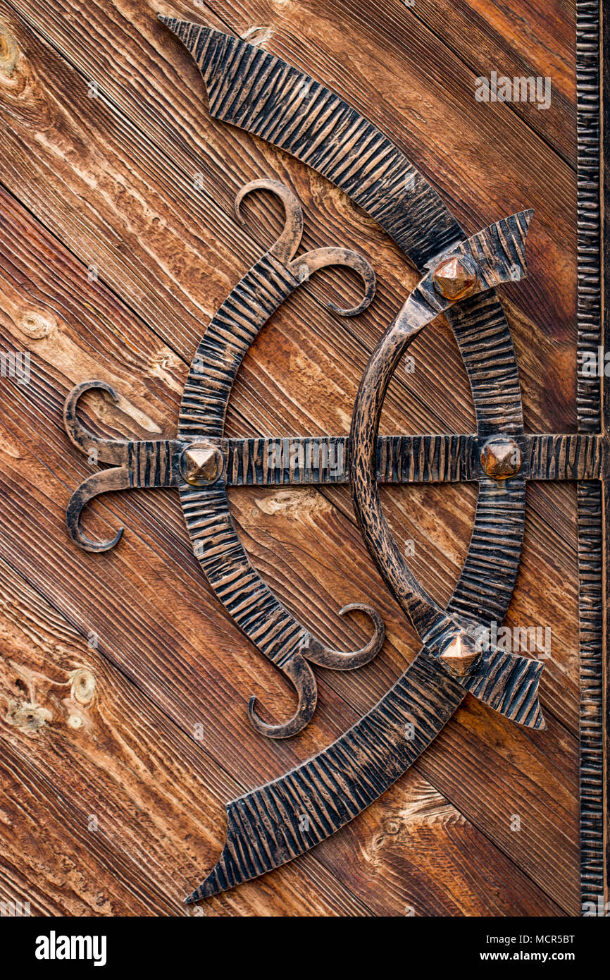 wooden gate with wrought iron elements close up Stock Photo - Alamy