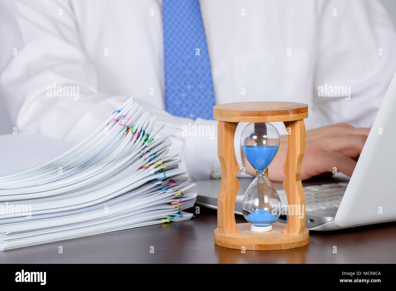 A businessman organizing a large number of documents Stock Photo - Alamy