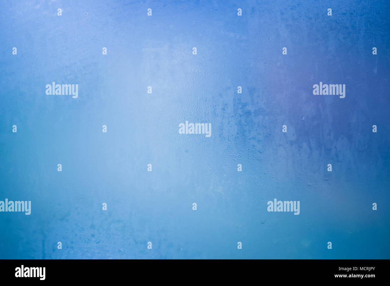 Condensed water on the window glass. Blue texture background of water ...