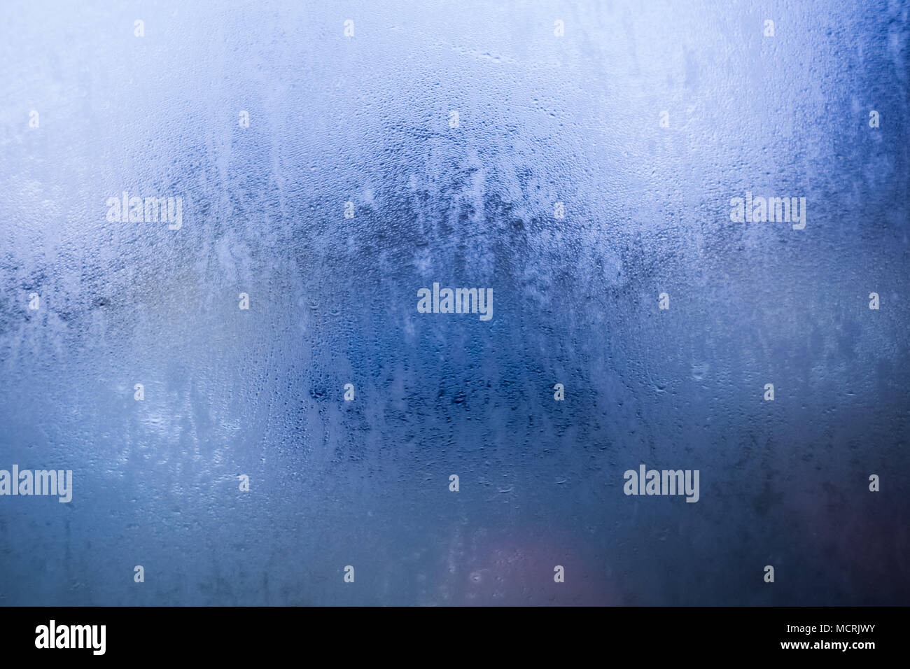 Condensed water on the window glass. Blue texture background of water ...