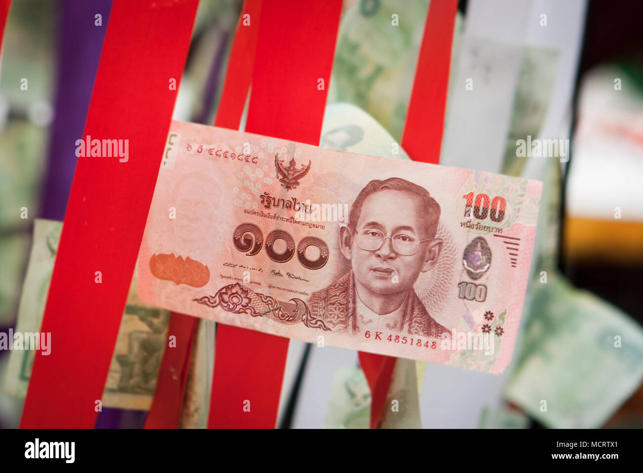 Donation Money. Thai Banknotes hanging on rope donated by visitors at ...