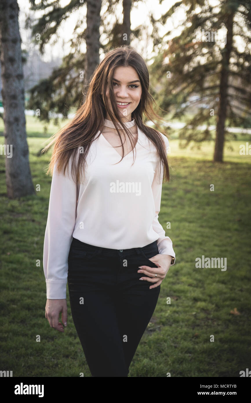 A portrait of a female model in the park posing, lifestyle Stock Photo ...