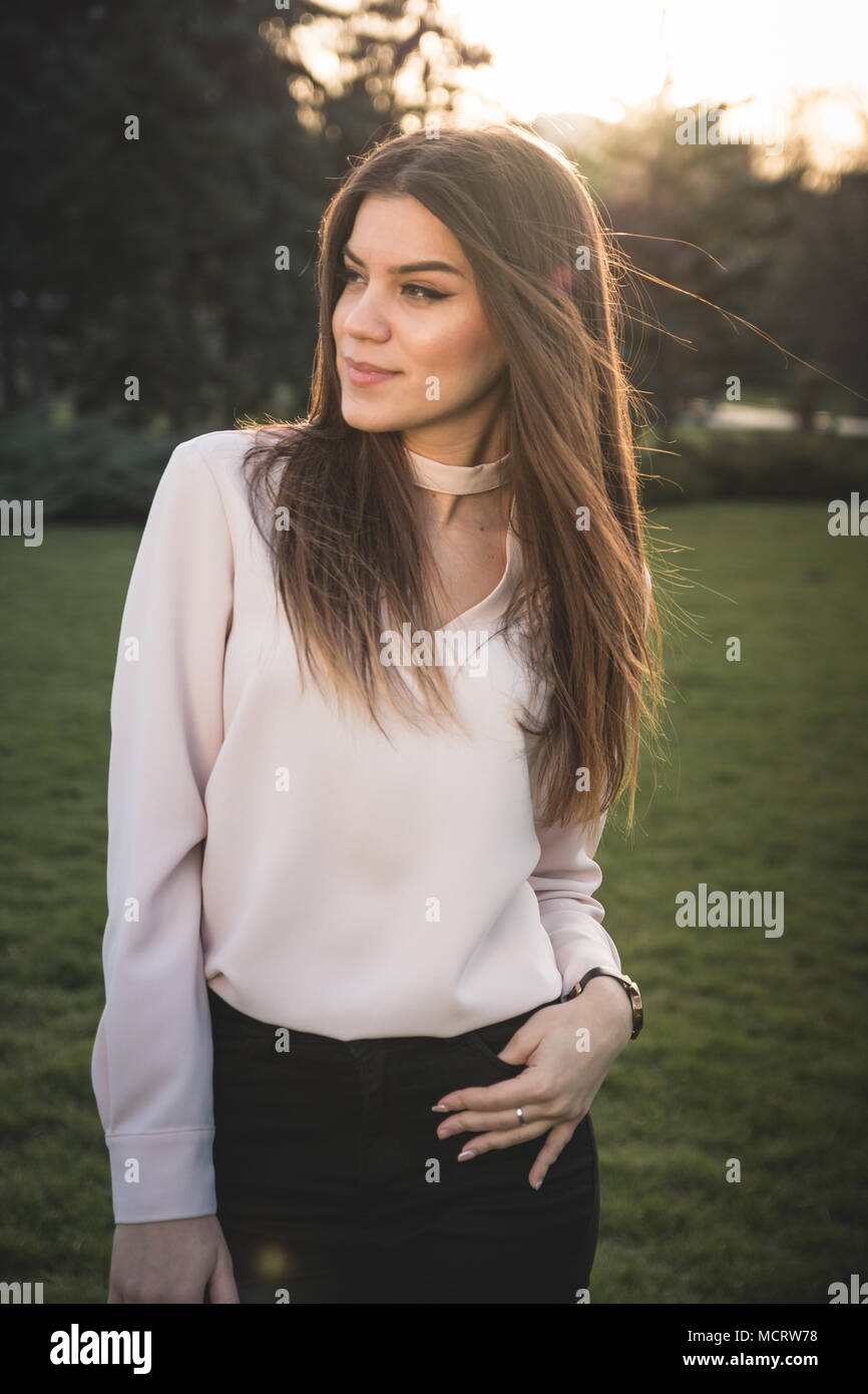 A portrait of a female model in the park posing, lifestyle Stock Photo ...