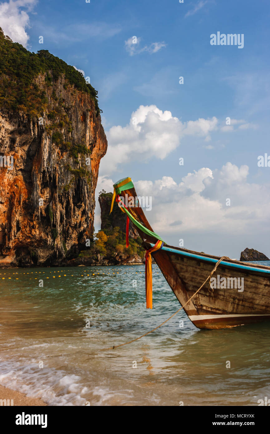 Traditional thai long tail boat at sunset in Railay beach, famous ...