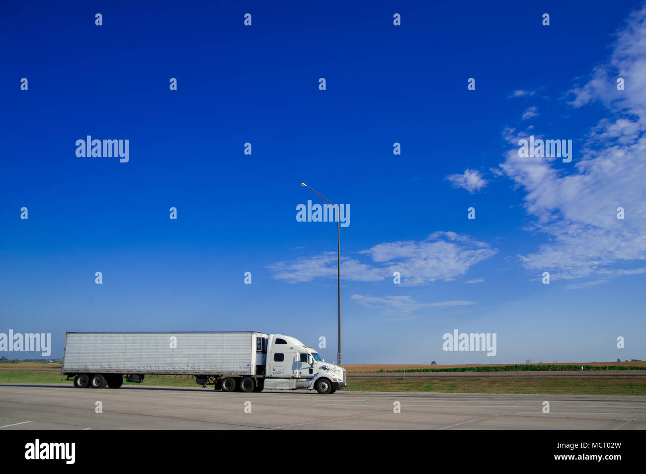Truck is running on the freeway of the country side in America. America ...