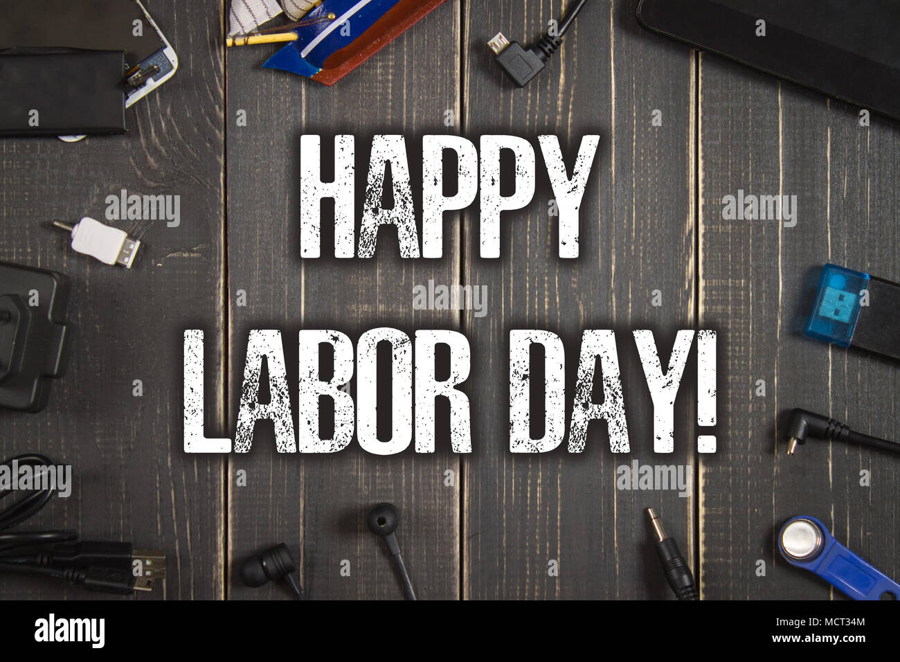 Electronic devices and elements on a dark wooden background. Place for ...