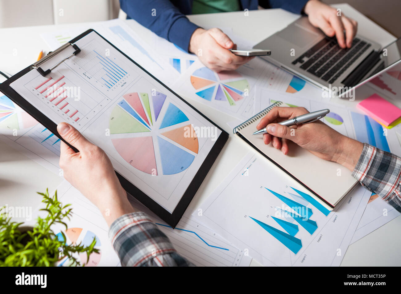 Stock market chart and finger pointing Stock Photo - Alamy