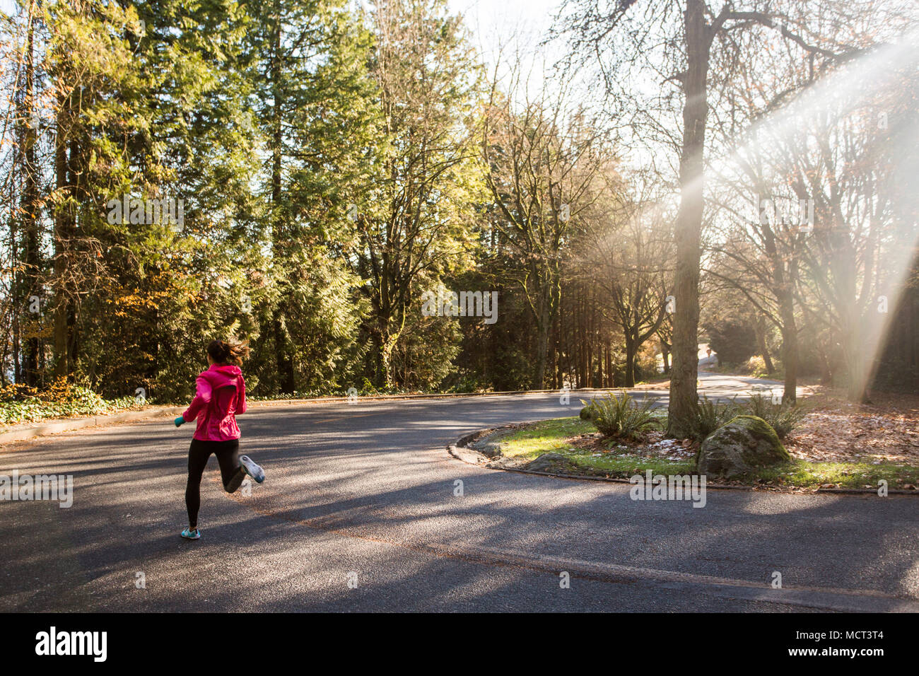 Rear view of female runner hi-res stock photography and images - Alamy