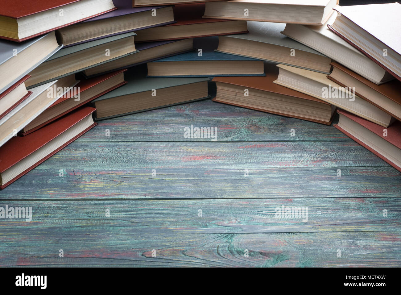 Book stacking open book hardback books on wooden table. copy space ...