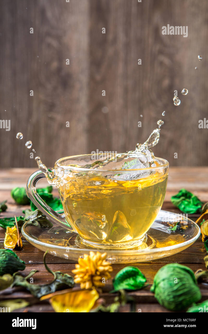 Spill cup of green tea Stock Photo - Alamy