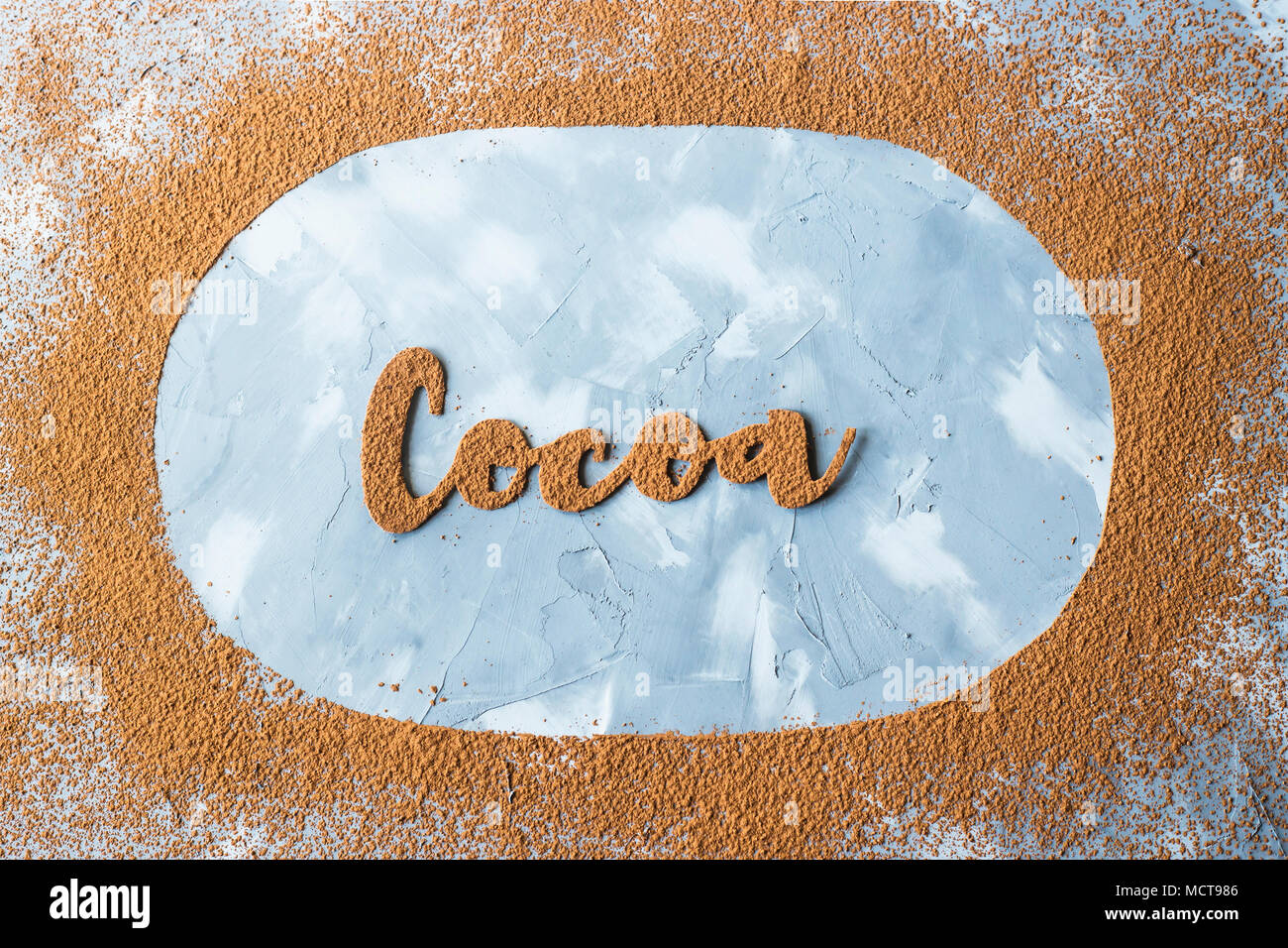 The word cocoa is written in letters of cocoa on a gray background in ...