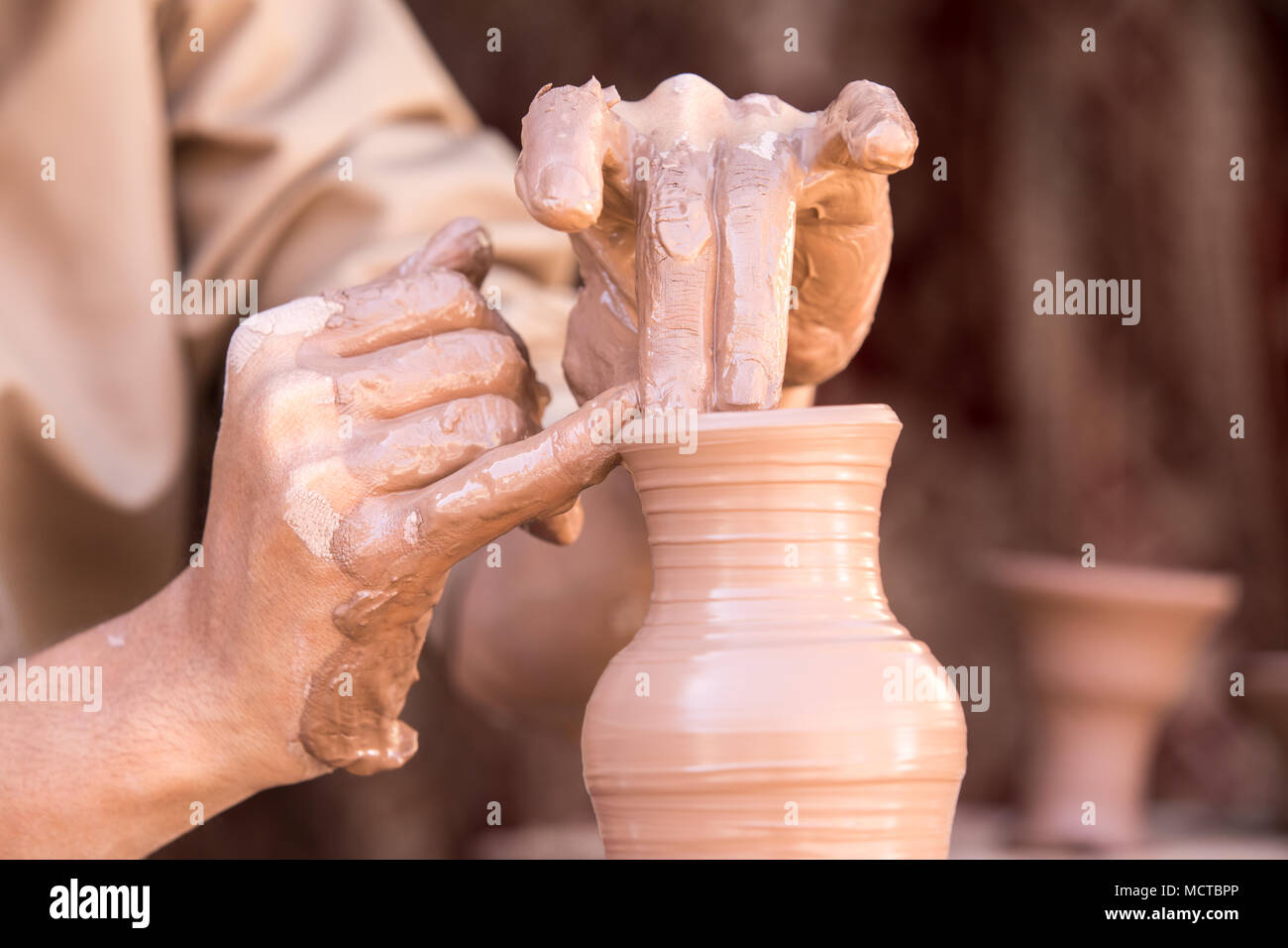 Hands doing pottery hi-res stock photography and images - Alamy