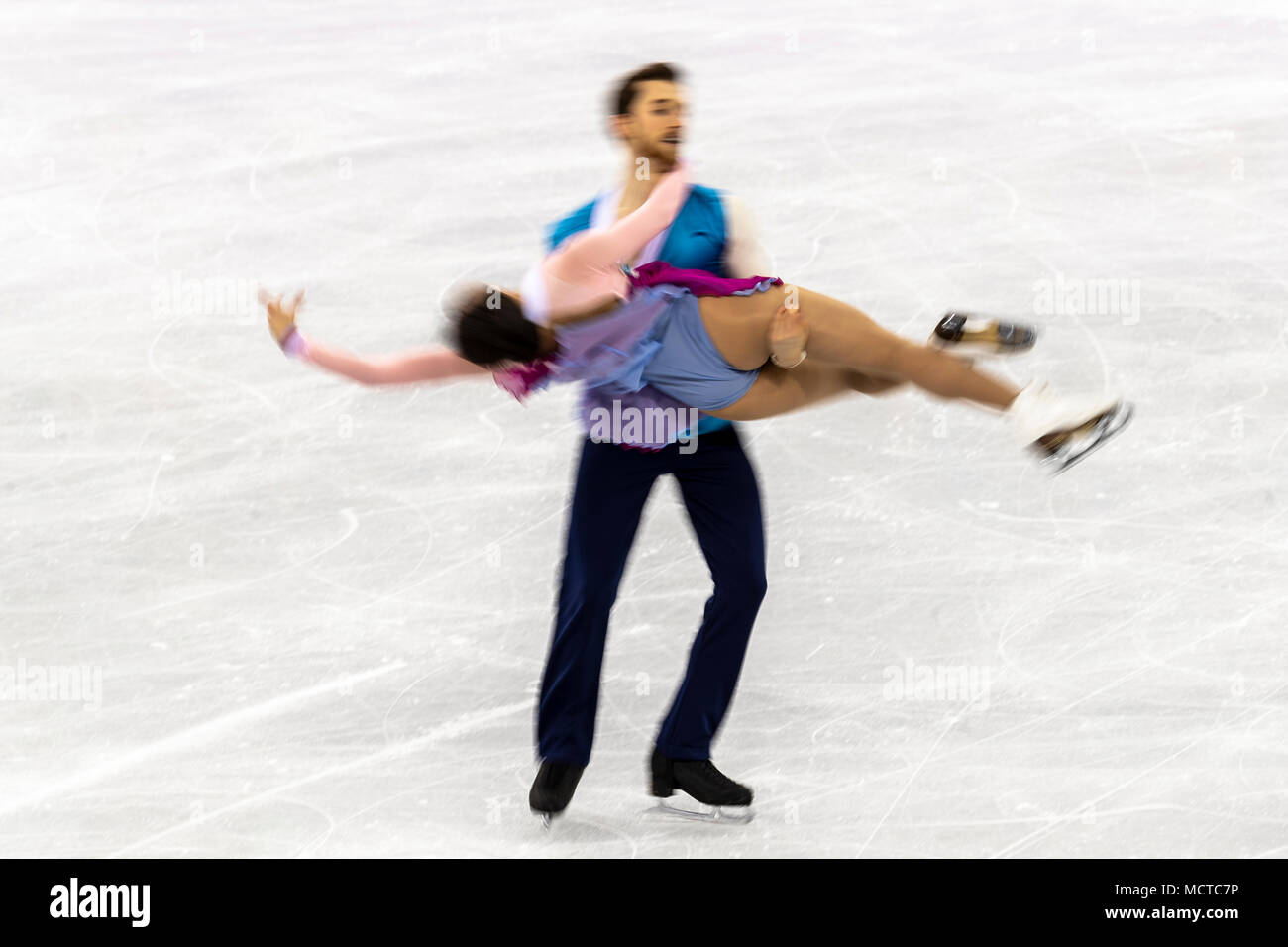Motion blur action of Yura Min/Alexander Gamelin (KOR) in the Figure ...