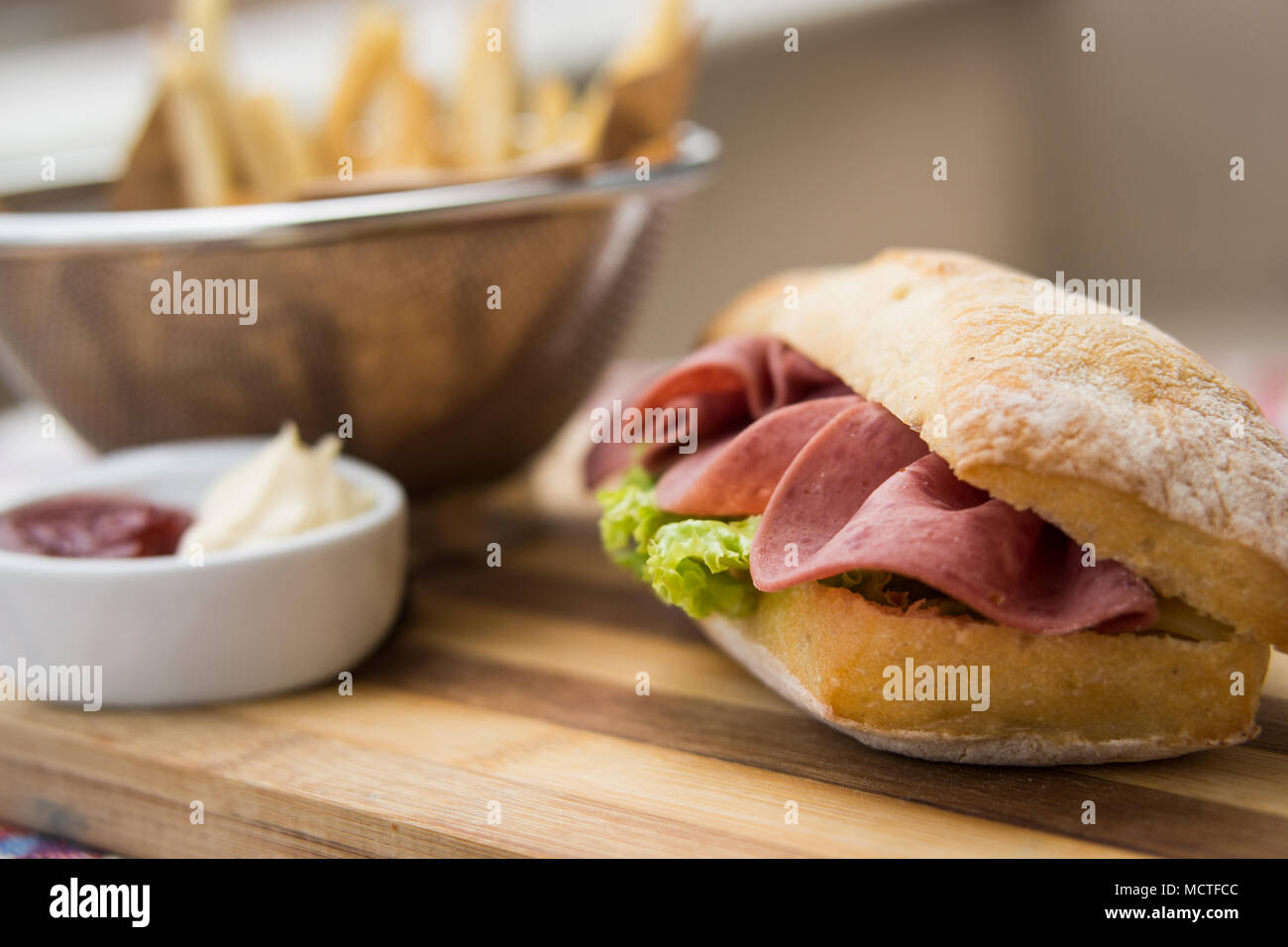 homemade ham sandwich with fried potatoes (French fries), ketchup and ...