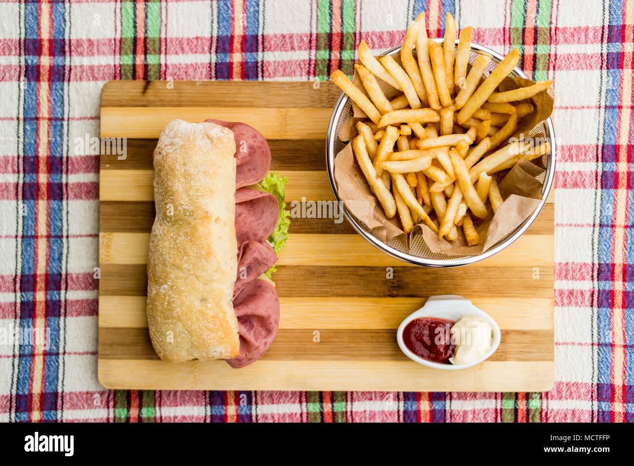 homemade ham sandwich with fried potatoes (French fries), ketchup and ...